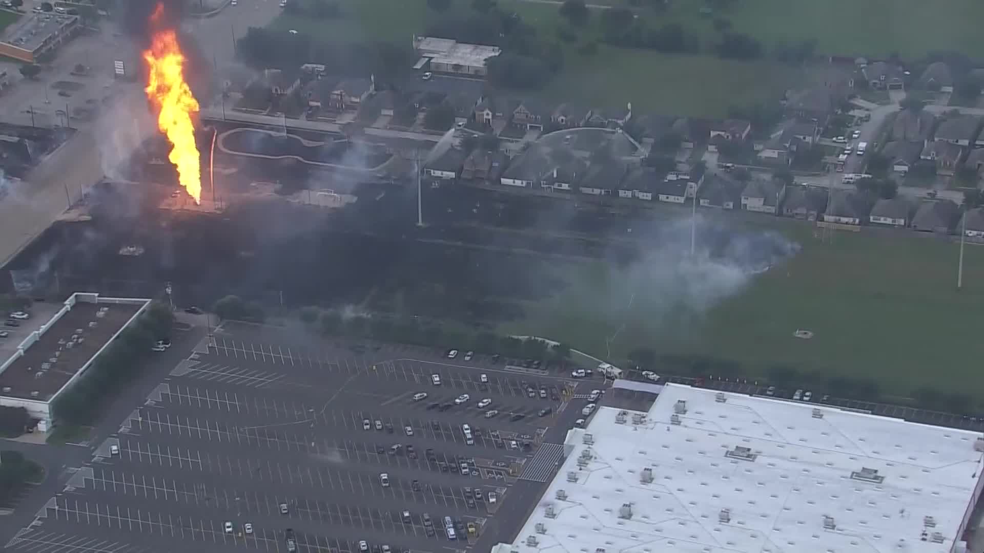 A pipeline explosion is shooting a towering pillar of flame over a ...