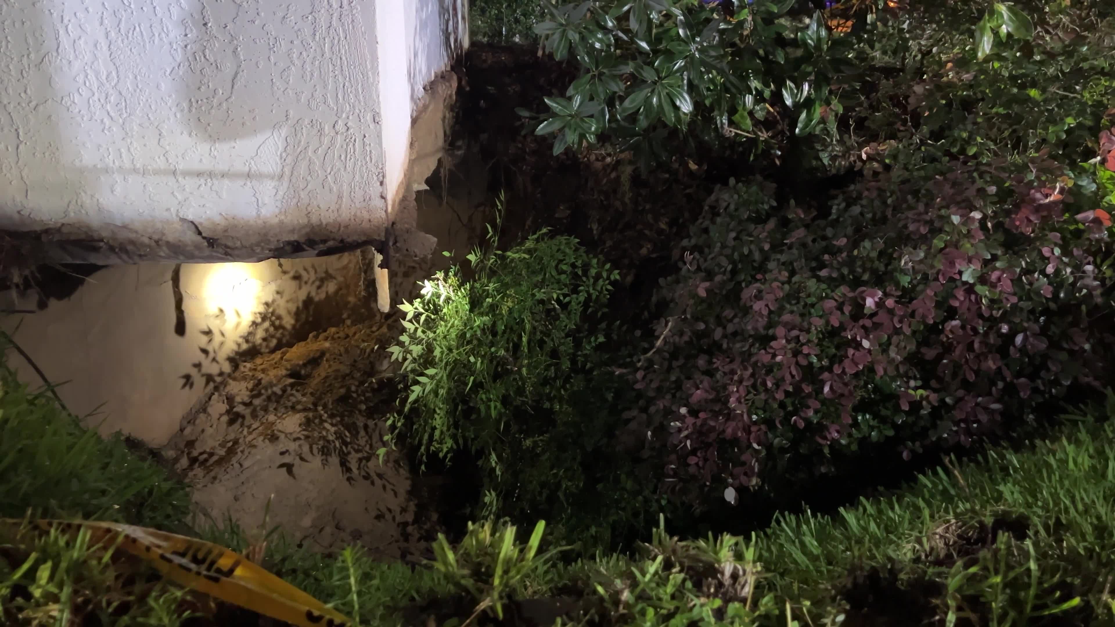 Residents evacuated after large ‘ground depression’ opens up under ...