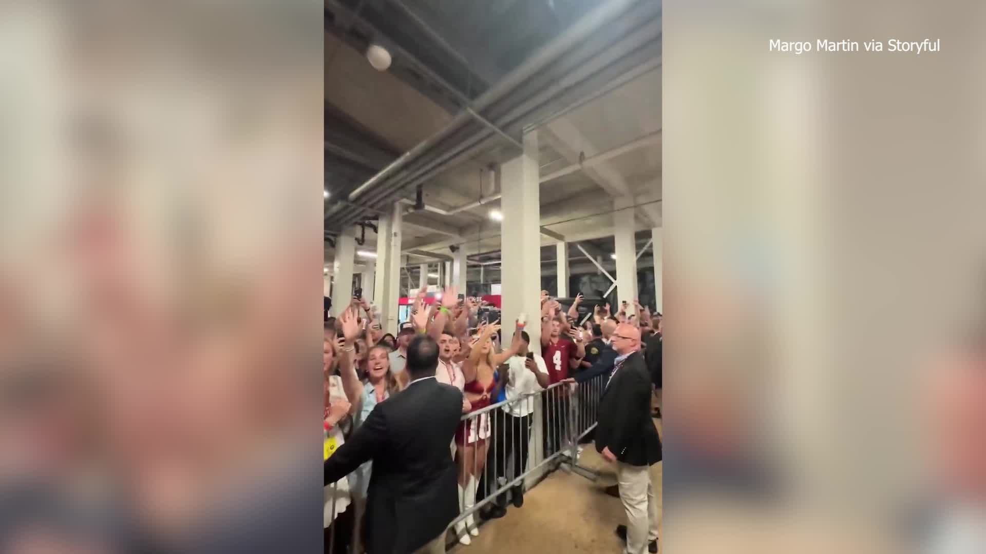 Donald Trump tosses chicken tenders into crowd at college football game ...
